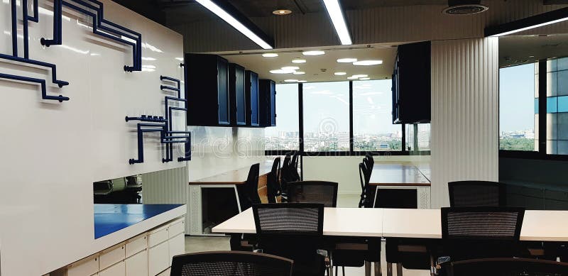 Modern Office and Work Place with Black Chairs, White Table and Blue ...