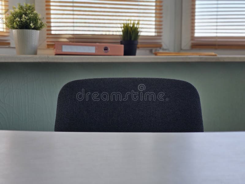Modern Office Workspace Featuring a Black Chair and Minimalist Decor ...