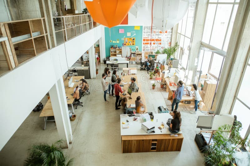 Modern Open Plan Office with High Ceilings and Natural Light Featuring ...