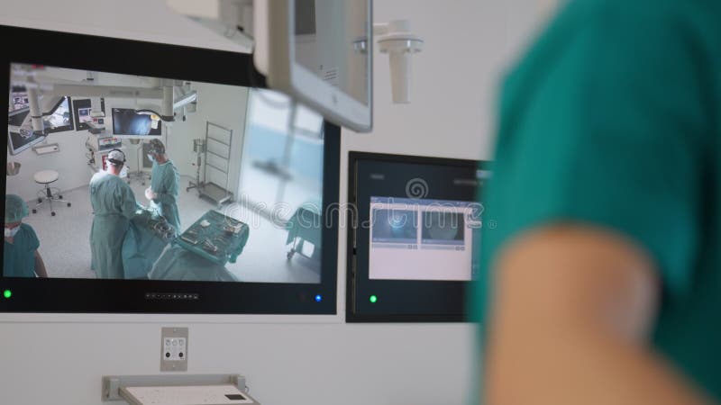 Modern Operating Room with Surgeons Performing a Procedure while Being ...
