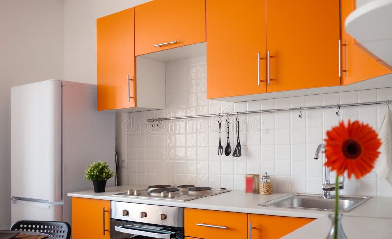 Modern orange kitchen stock photo. Image of house, oven - 83773300