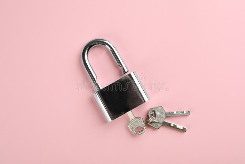 Modern Padlock with Keys on Pink Background, Top View Stock Image ...