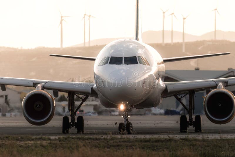 Airplane Runway Sunset Wind Turbines Stock Photos - Free & Royalty-Free ...