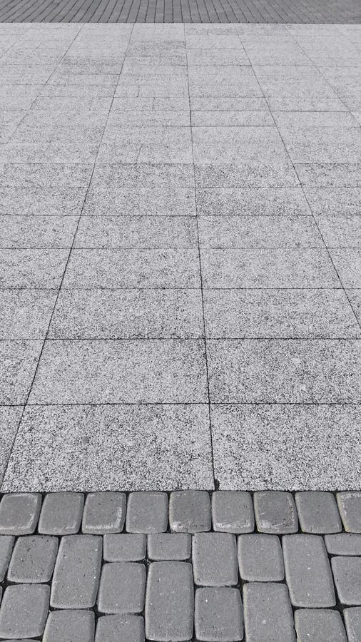 New Modern Paving Made with Stone Wave-shaped in a Italian Pedestrian ...