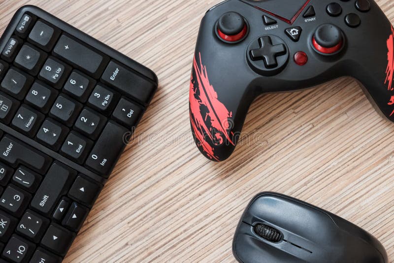 Modern Pc Keyboard, Mouse and Game Pad on Wooden Table Stock Photo ...