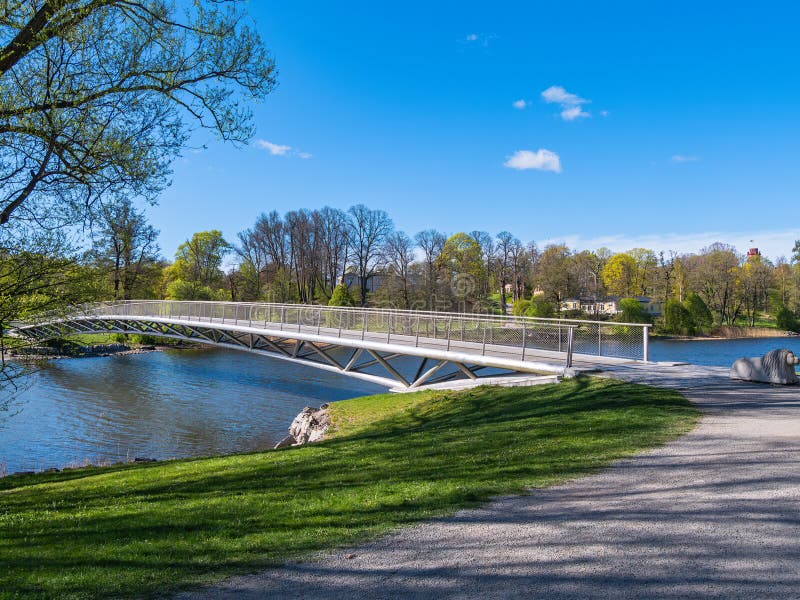 Modern Pedestrian Bridge Over Calm River Stock Image - Image of bridge ...