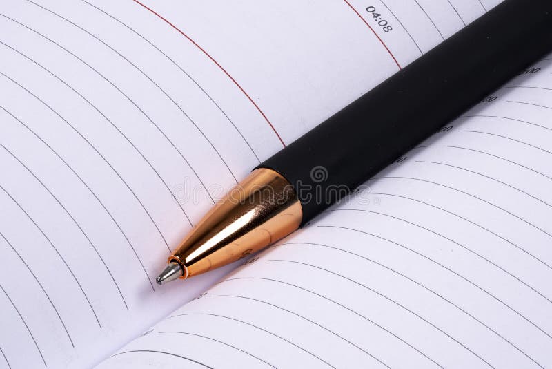Modern Pen Resting on an Open Notebook with Lined Pages Stock Image ...