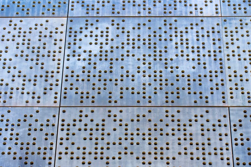 Modern Perforated Metal Wall with Stylish Patterns Stock Image - Image ...