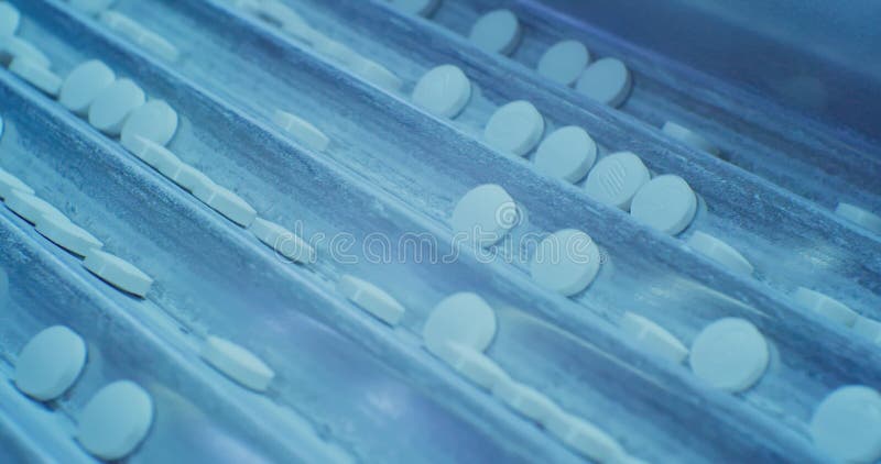 Modern Pharmaceutical Production.white Round Tablets Move on the ...