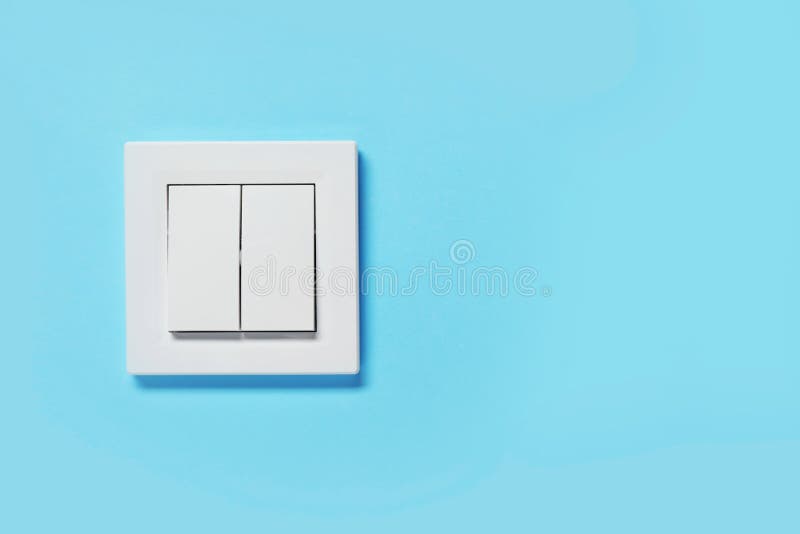 Modern Plastic Light Switch on Blue Wall, Space for Text Stock Photo ...