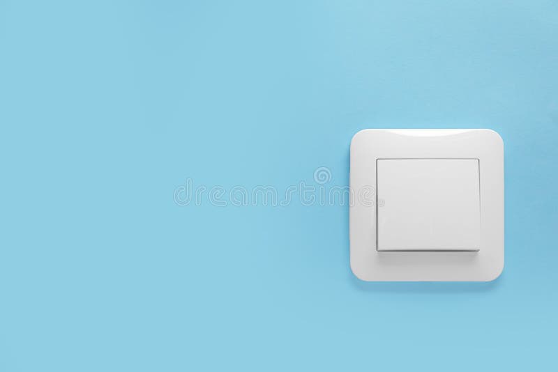 Modern Plastic Light Switch on Blue Wall, Space for Text Stock Image ...