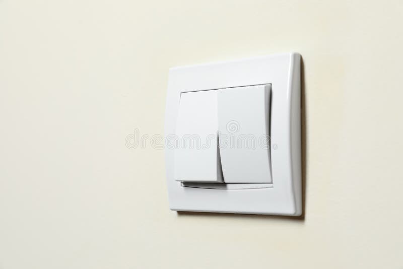 Modern Plastic Light Switch on White Wall, Closeup. Space for Text ...