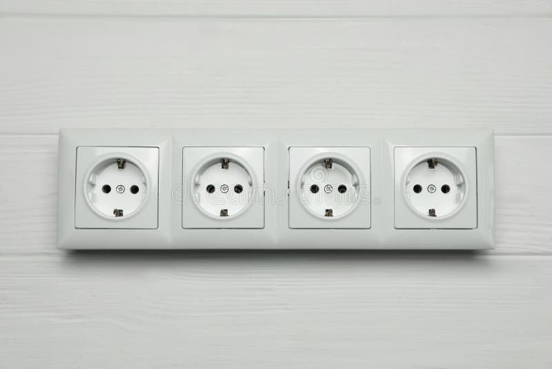 Modern Plastic Power Socket on White Wooden Table, Top View Stock Photo ...