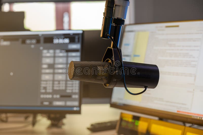 Modern Podcasting Setup with Microphone in Studio, Computer Screens and ...
