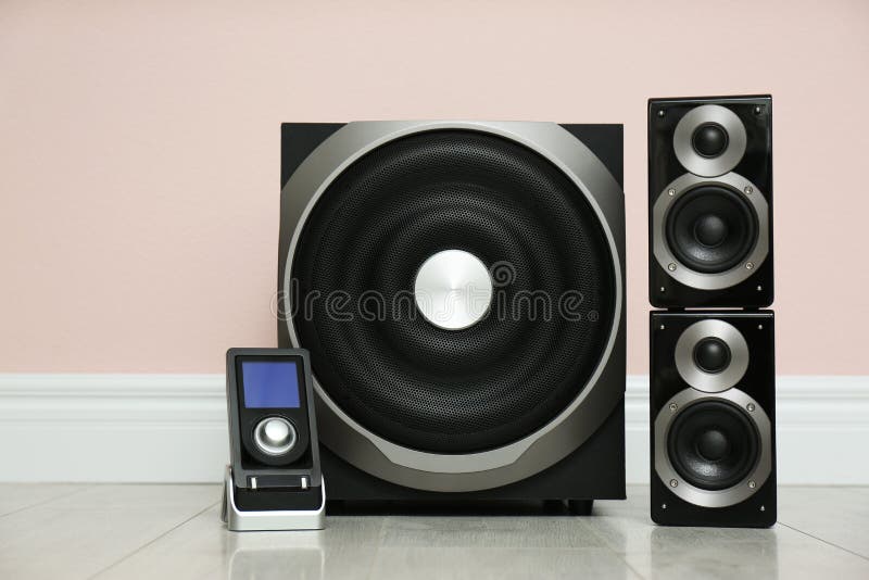 Modern Powerful Audio Speaker System on Floor Near Pink Wall Stock ...