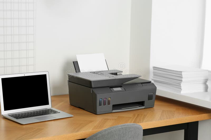 Modern Printer with Paper and Laptop on Table in Office Stock Image ...