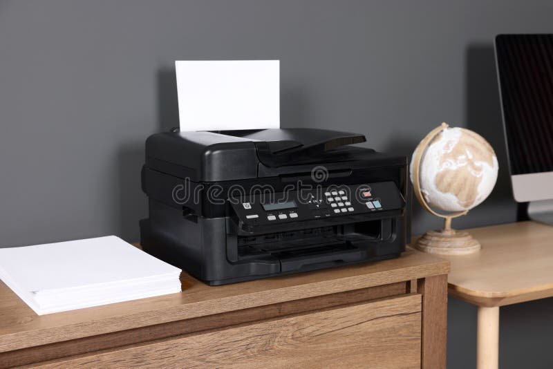 Modern Printer with Paper Near Computer on Desk at Home Stock Photo ...