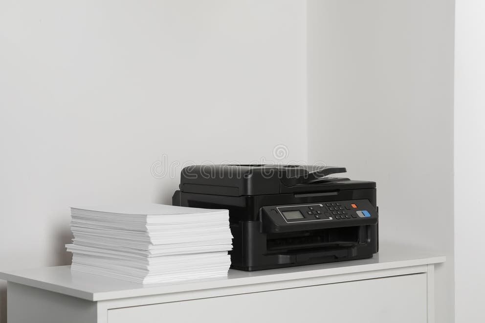 Modern Printer and Paper Sheets on White Chest of Drawers Stock Image ...