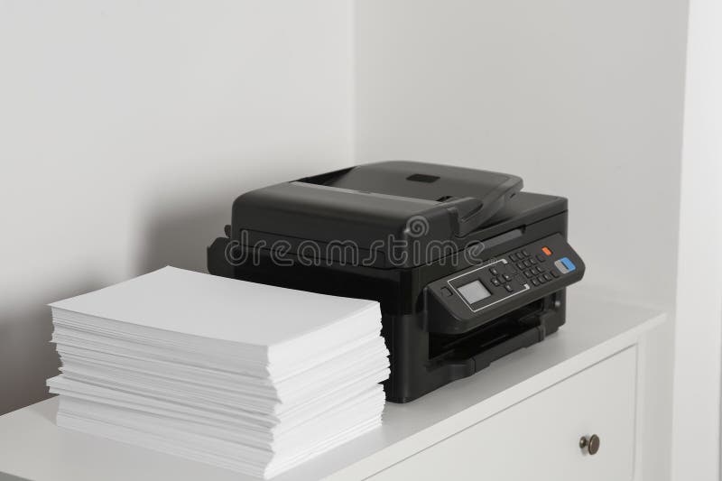 Modern Printer and Paper Sheets on White Chest of Drawers Stock Photo ...
