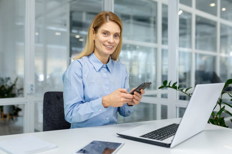 Professional Woman Texting in Modern Office Setting Stock Photo - Image ...