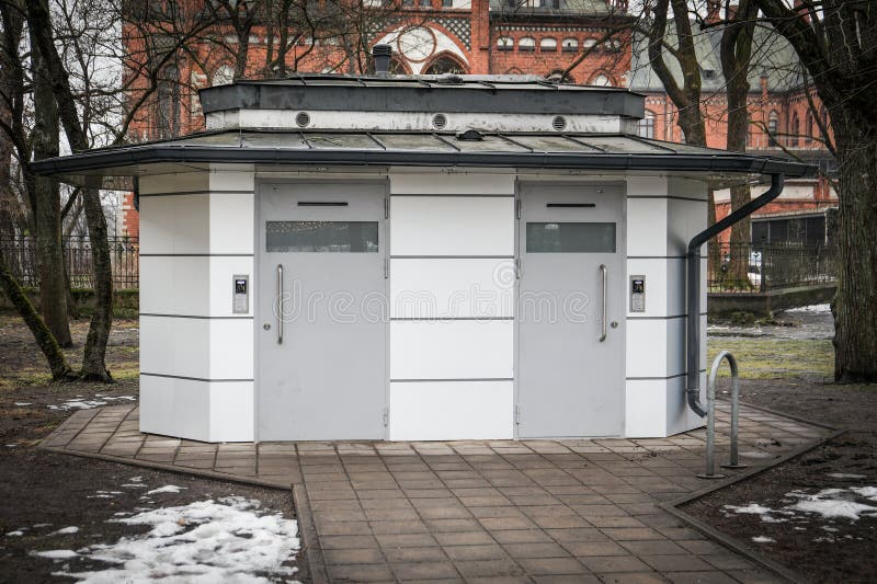 Modern Public Restroom in Urban Park with Gray Exterior and Access ...