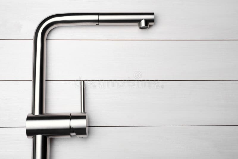 Modern Pull Out Kitchen Tap on White Wooden Table, Top View. Space for ...