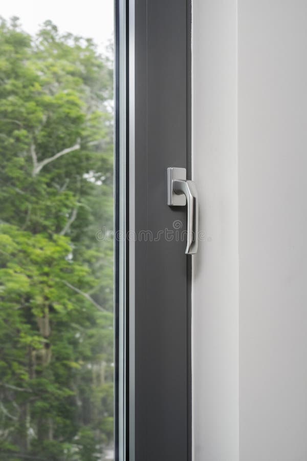 Modern Pvc Window with Silver Knob and Gray Frame Installed in ...