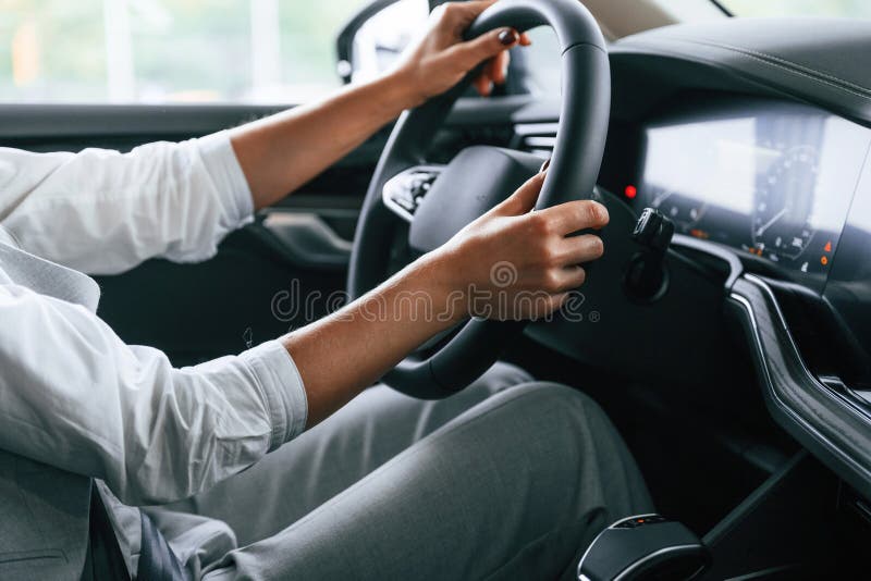 Modern Quality Interior. Woman is Sitting in a Car and Driving it Stock ...