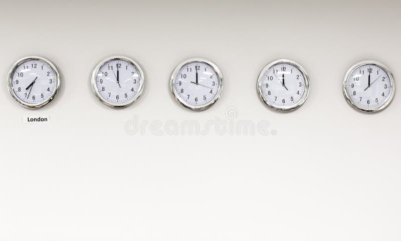 Modern Quarz Analog Clocks on White Wall in Office Stock Photo - Image ...
