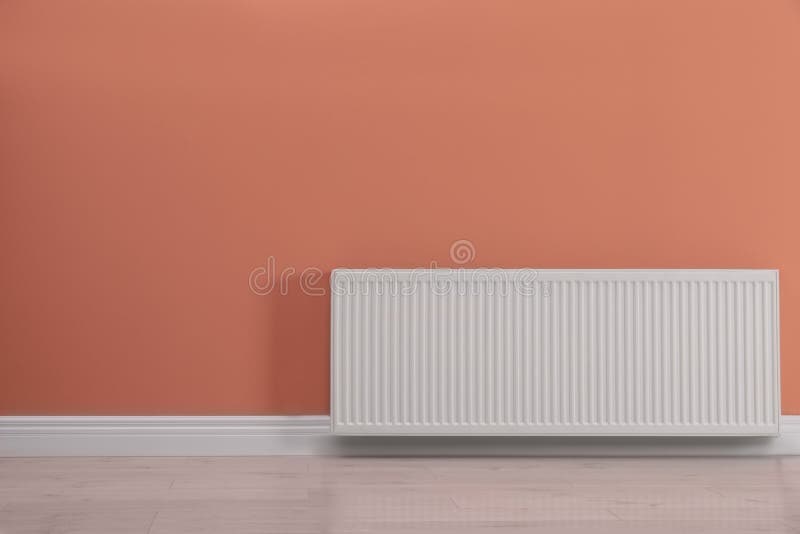 Modern Radiator on Color Wall, Space for Text. Central Heating System ...