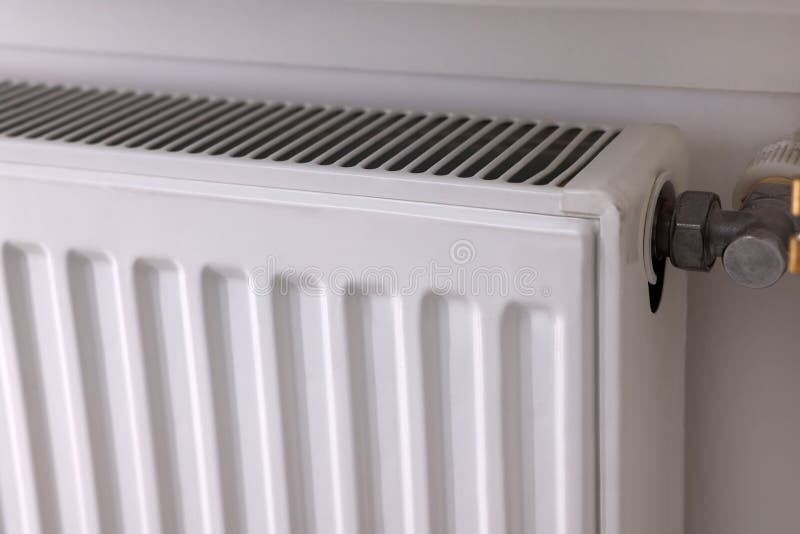 Modern Radiator on White Wall, Closeup. Central Heating System Stock ...