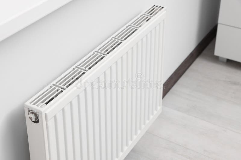 Modern Radiator on White Wall in Room. Central Heating System Stock ...