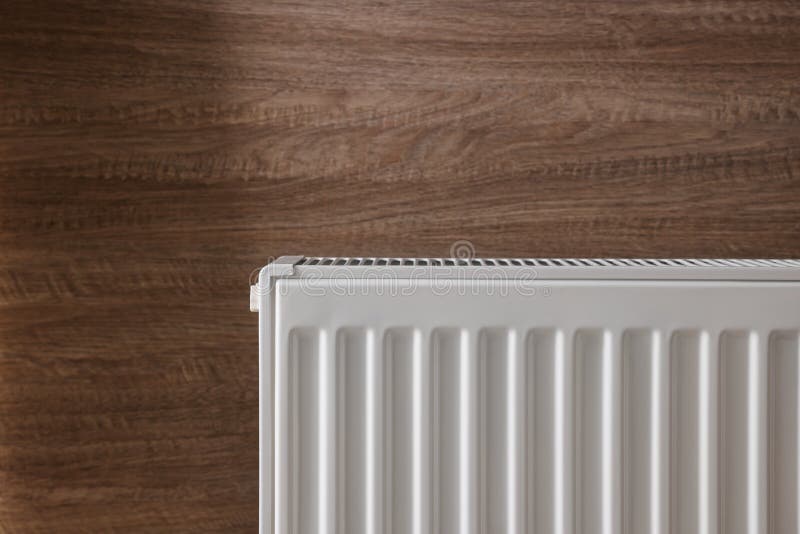 Modern Radiator on Wooden Wall. Central Heating System Stock Photo ...