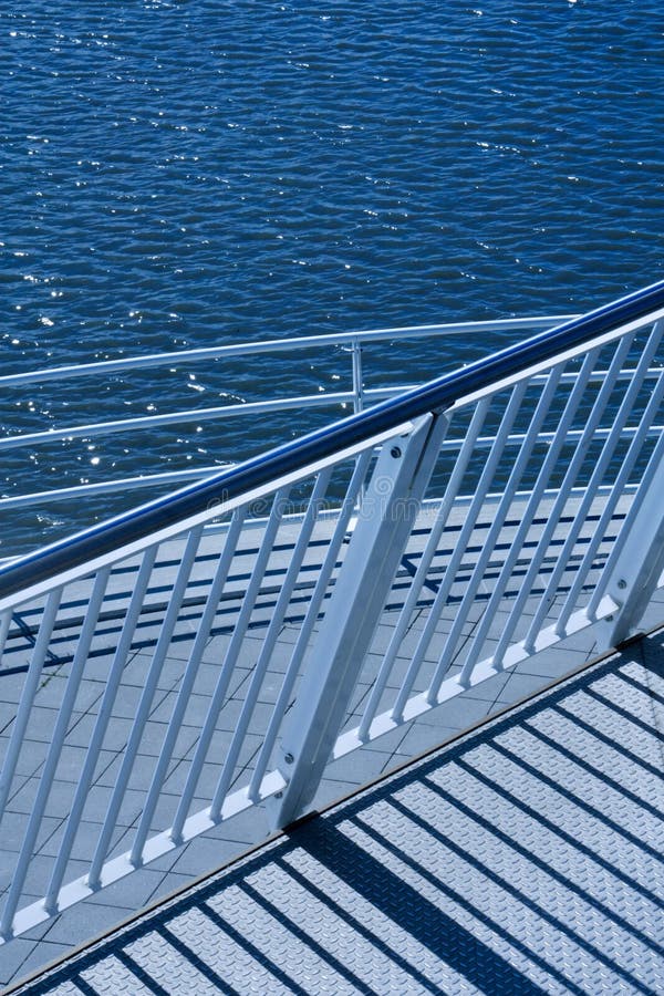 Metal railing by the water stock image. Image of handrail - 591741