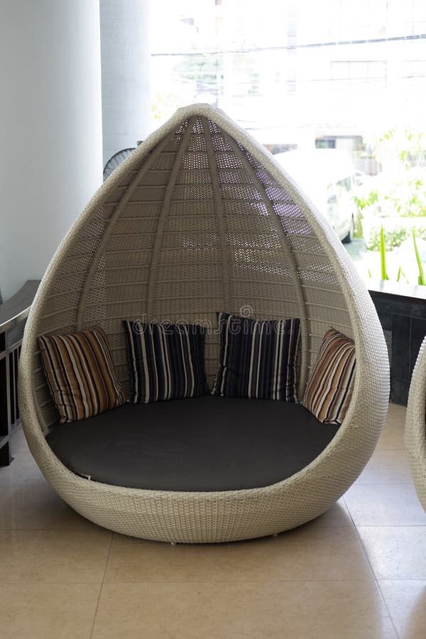 Modern Rattan Wicker Chair with Green Natural Plant and Wooden Floor ...