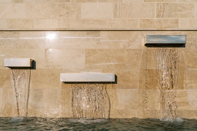 Modern Rectangular Fountains on a Marble Wall Stock Image - Image of ...