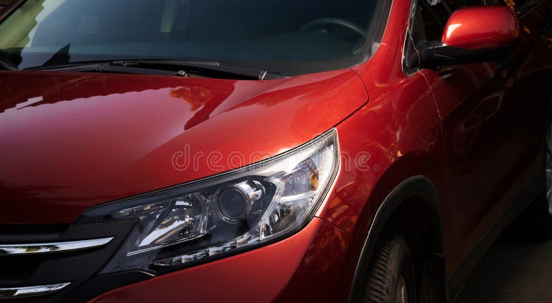 Modern red car headlight stock image. Image of metal - 146413977
