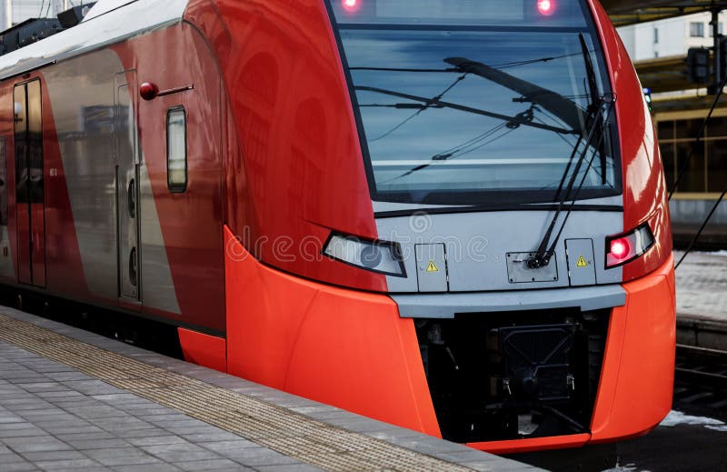 Modern red commuter train stock photo. Image of locomotive - 294495344