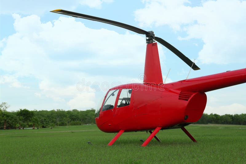 Modern Red Helicopter on Green Grass Outdoors Stock Image - Image of ...