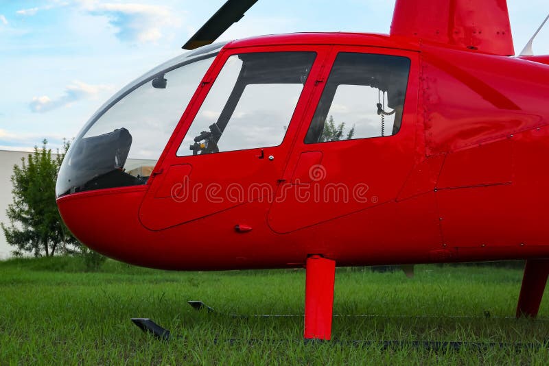 Modern Red Helicopter on Green Grass Outdoors Stock Image - Image of ...