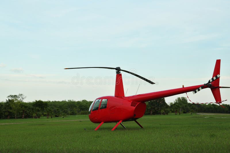 Modern Red Helicopter on Green Grass Outdoors Stock Photo - Image of ...