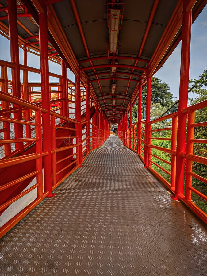 Modern Red Pedestrian Bridge with Geometric Patterns Stock Photo ...