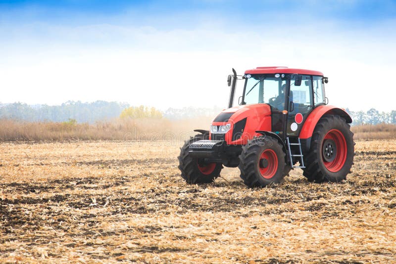 Modern Red Tractor in the Field. Stock Photo - Image of farmland ...
