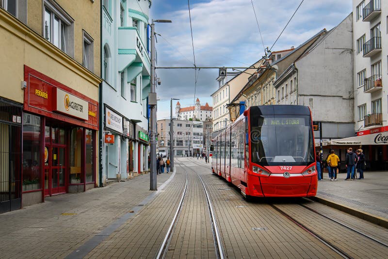 Modern Red Tram in Front of the Bratislava Castle in Slovakia Editorial ...
