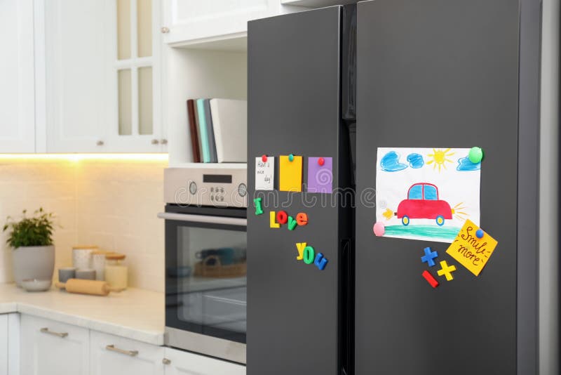 Refrigerator with Child`s Drawing, Notes and Magnets in Kitchen Stock ...