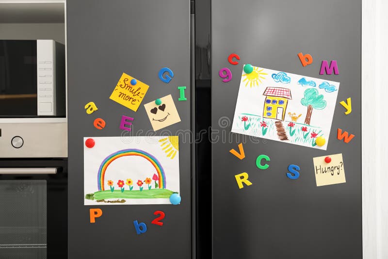 Modern Refrigerator with Child`s Drawings, Notes and Magnets Stock ...
