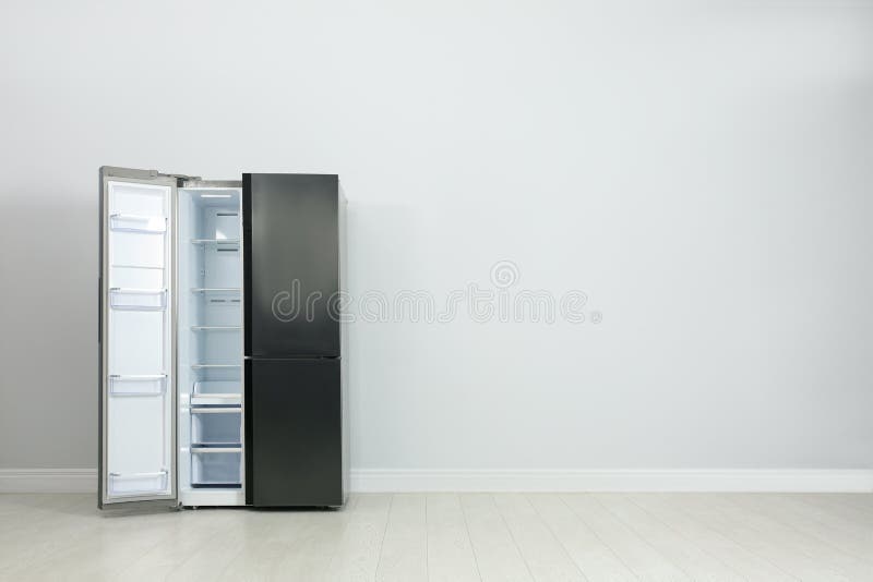 Modern Refrigerator Near Light Grey Wall Stock Image - Image of kitchen ...
