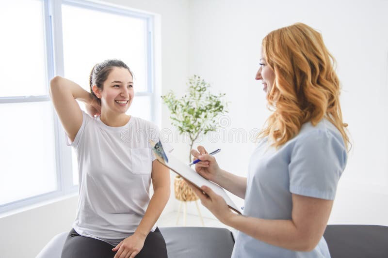 Modern Rehabilitation Physiotherapy at Work with Client Stock Photo ...