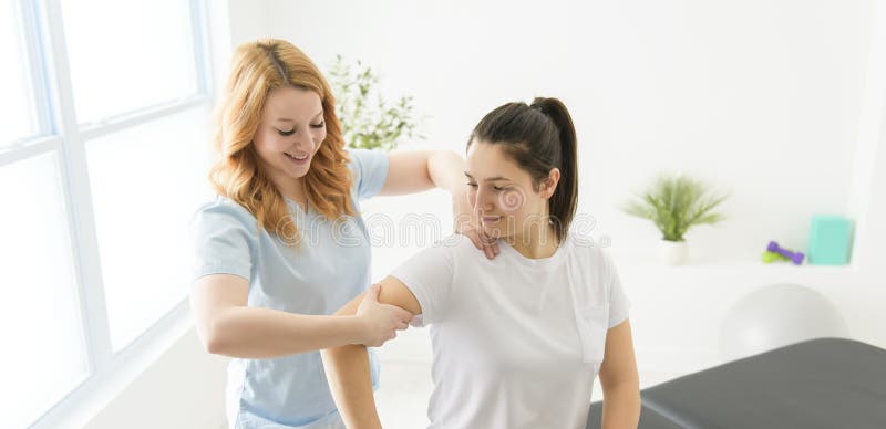 Modern Rehabilitation Physiotherapy at Work with Client Stock Image ...