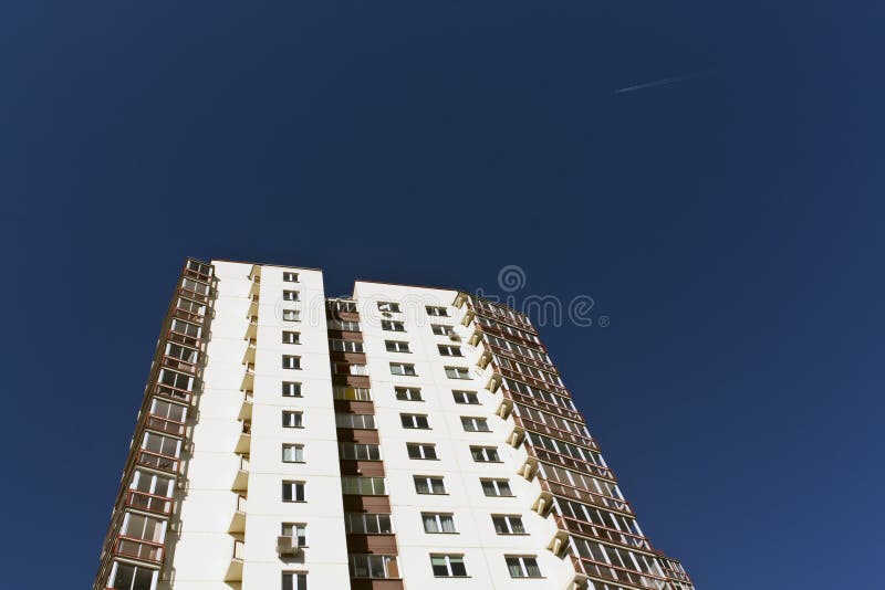 Modern Residential Building and Plane Trace in the Sky. Stock Image ...